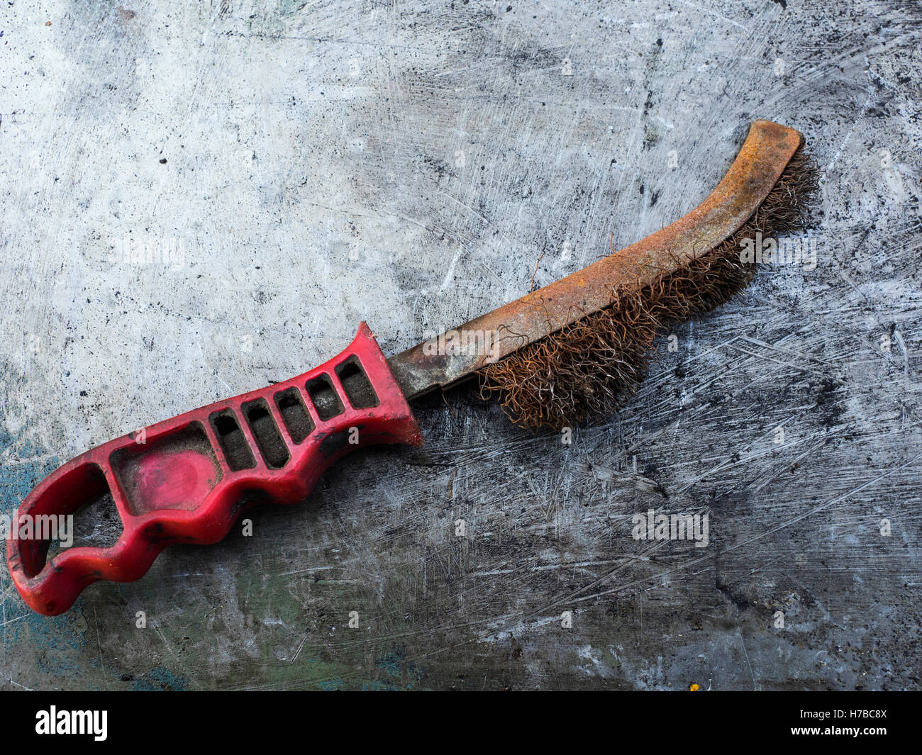 Old rusty brass brush on metal background Stock Photo - Alamy