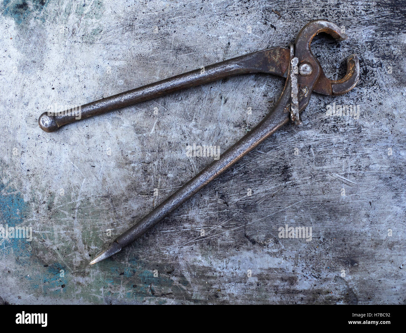 Old rusty Pincer Pliers on metal background Stock Photo - Alamy