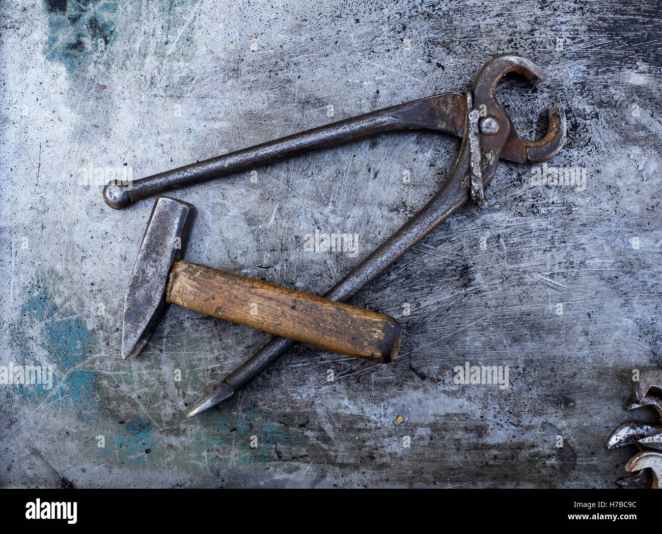 Old rusty himmer and Pincer Pliers on metal background Stock Photo - Alamy