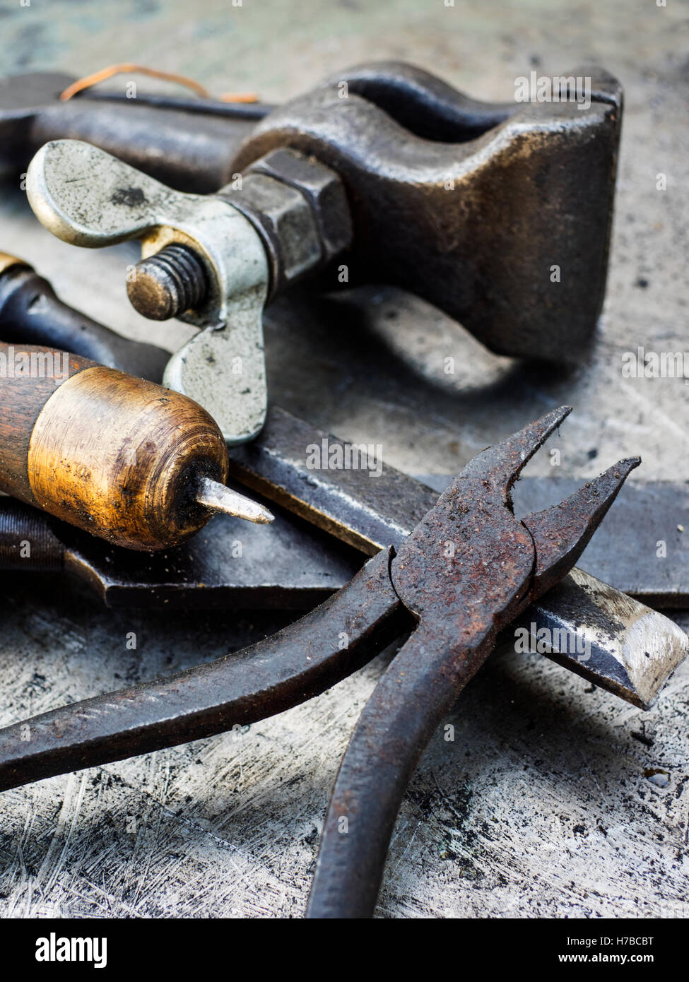 Old rusty small tools on metal background. Selective focus Stock Photo ...
