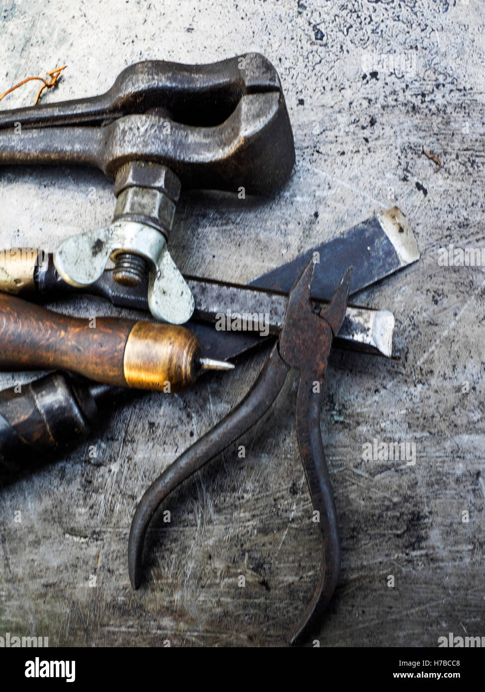 Old rusty small tools on metal background. Selective focus Stock Photo ...