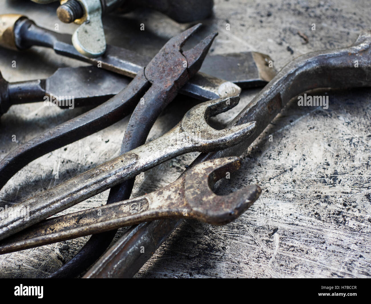 Old rusty small tools on metal background. Selective focus Stock Photo ...