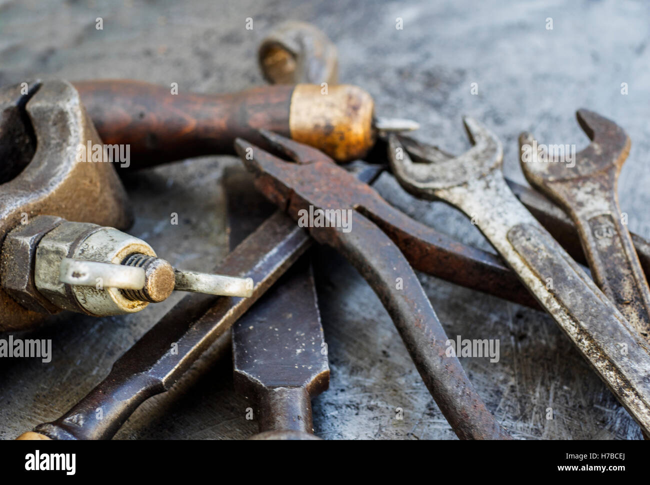 Old rusty small tools on metal background. Selective focus Stock Photo ...
