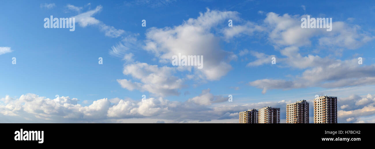 blue sky with cloud, city with tall buildings Stock Photo - Alamy