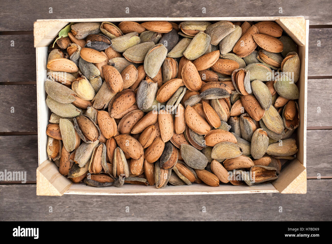 Wooden box of almonds in their shells Stock Photo - Alamy