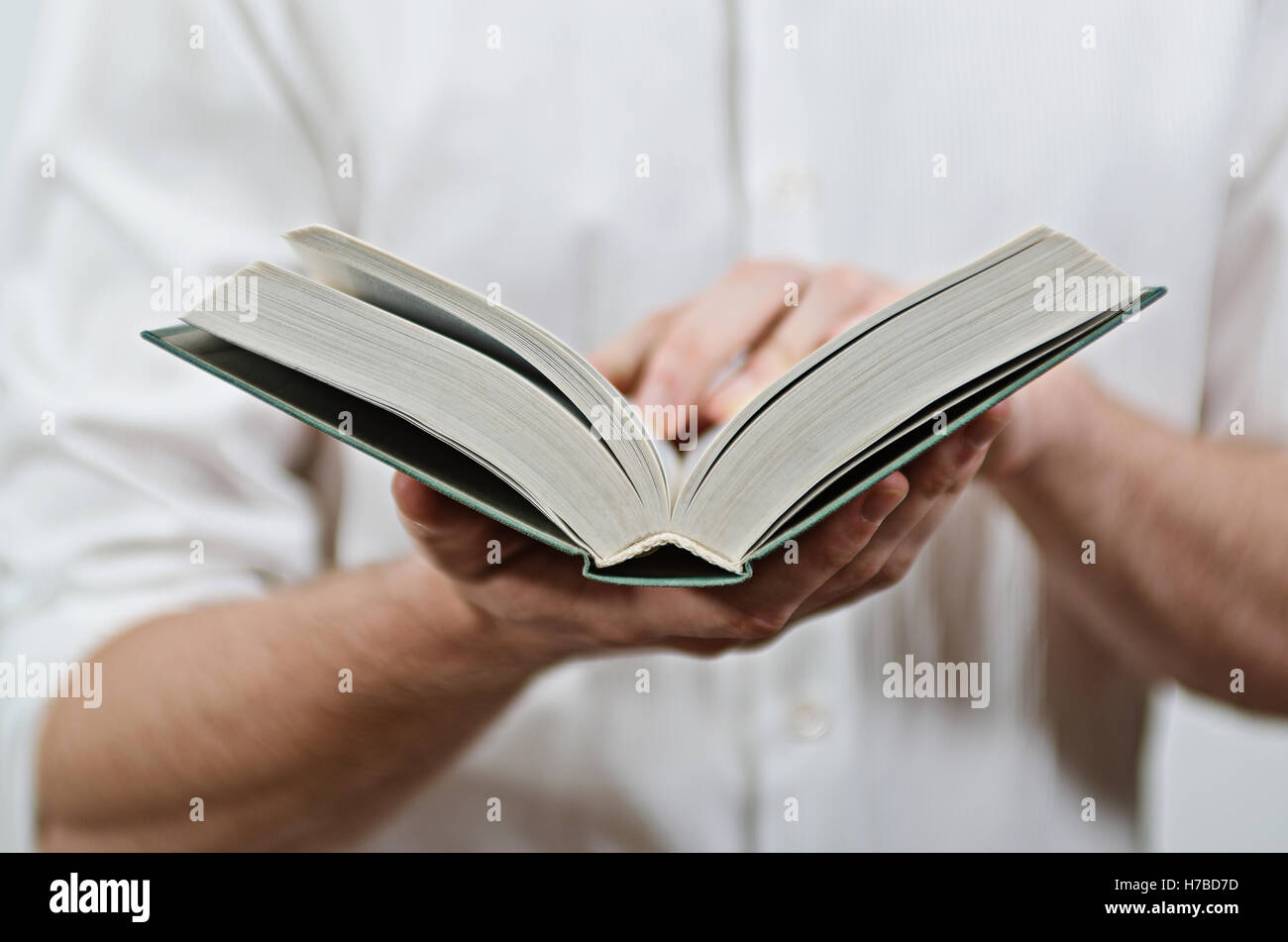 Young Adult Man's Hands Close-Up, Reading a Book Stock Photo - Alamy