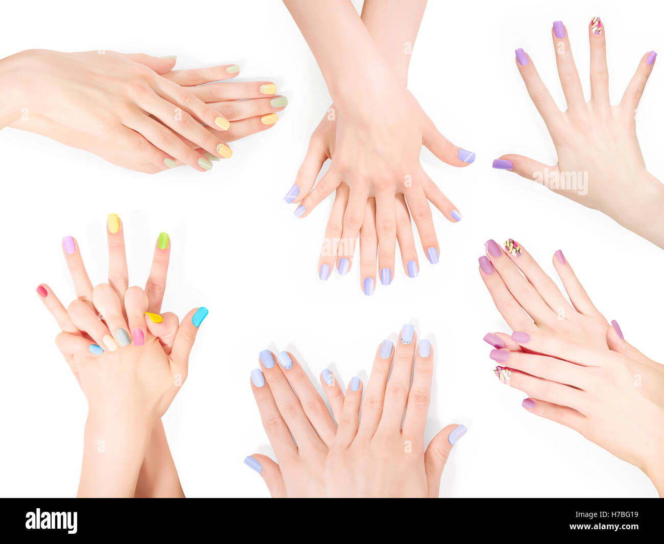 Bundle of hands with creative shellac art manicure. Isolated on white ...