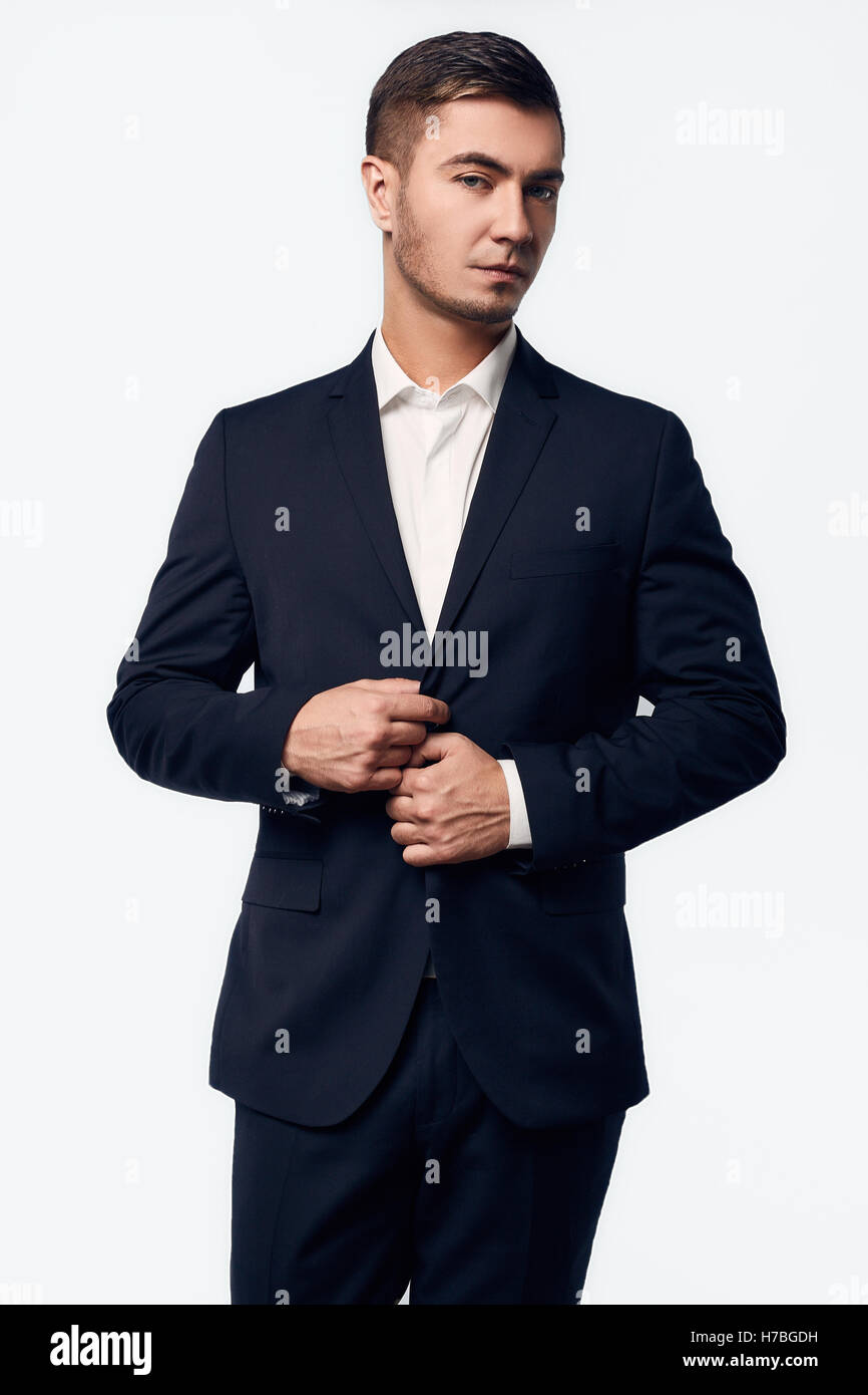 young handsome business man in suit isolated on white background in ...