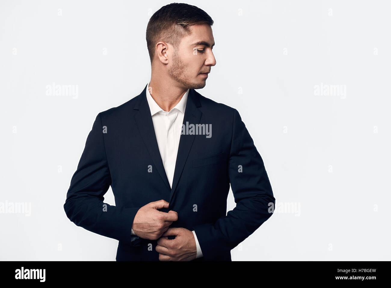 young handsome business man in suit isolated on white background in ...