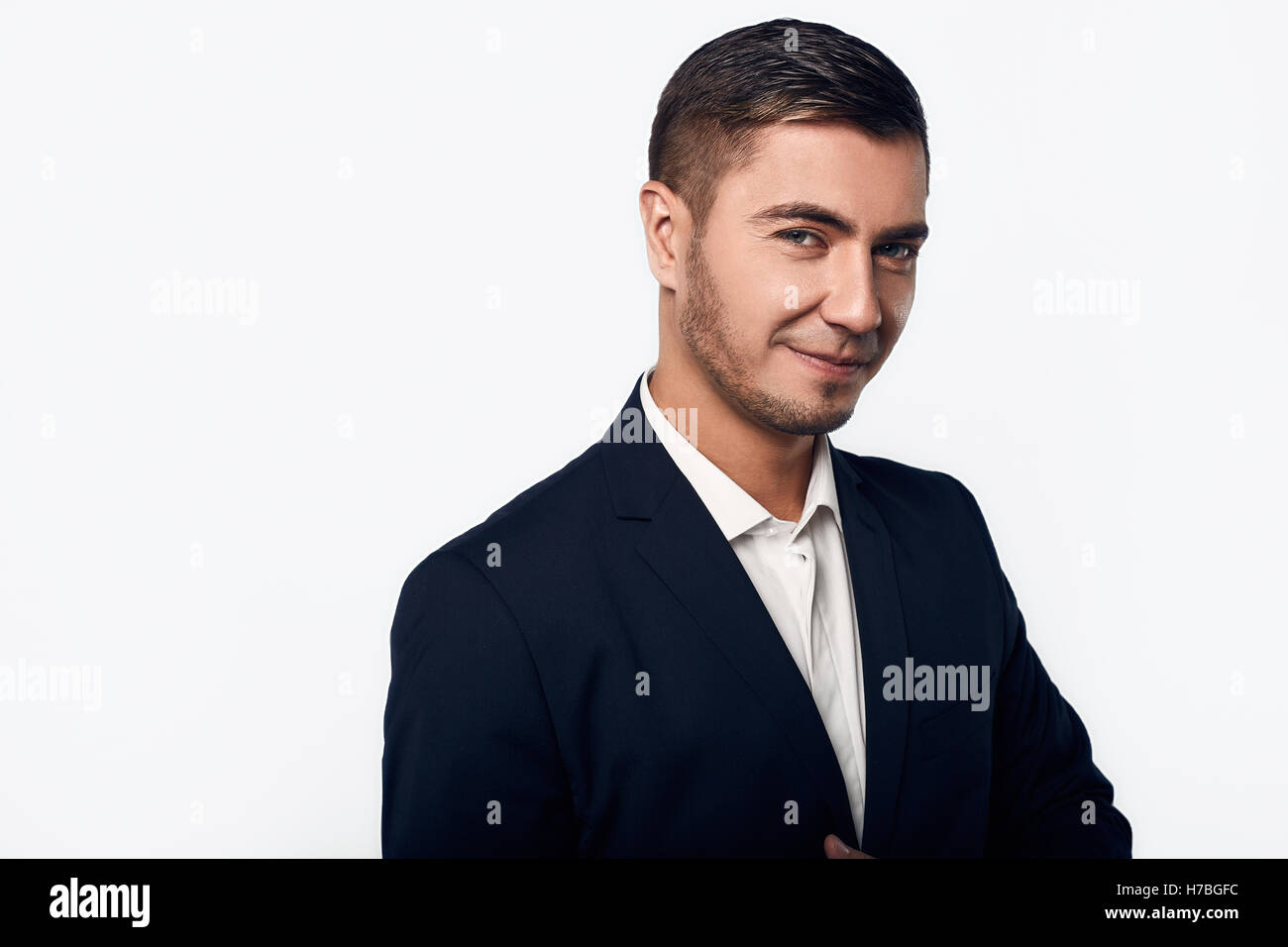 young handsome business man in suit isolated on white background in ...