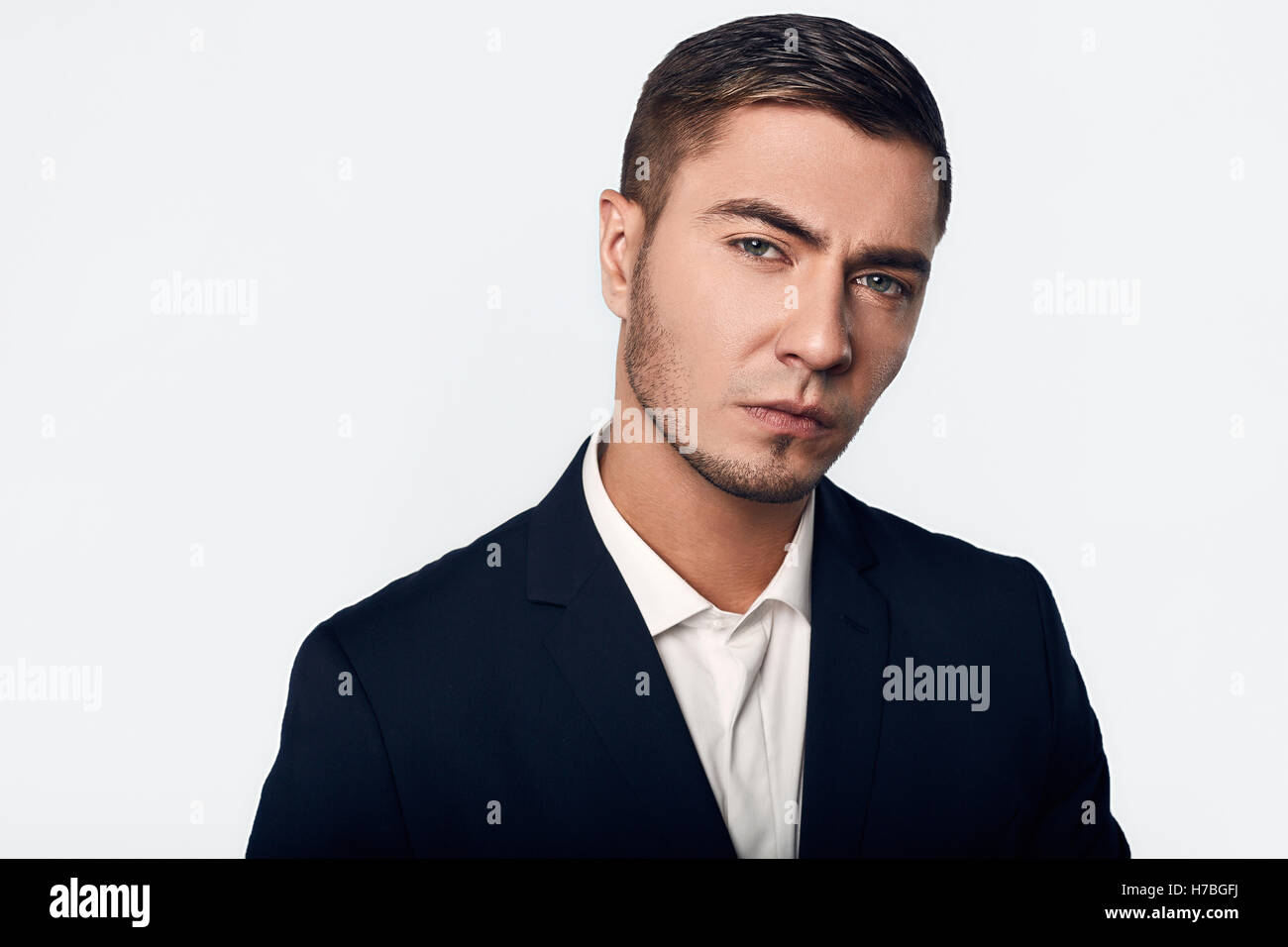 young handsome business man in suit isolated on white background in ...