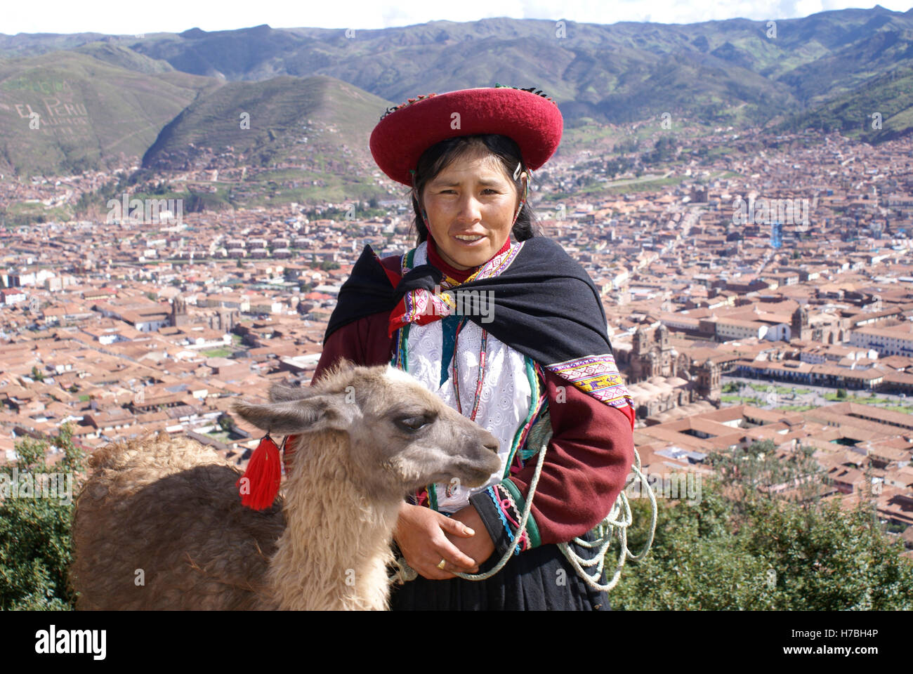 Aerieal view of Cuzc, Peru with Inca woman and Llama in foreground ...