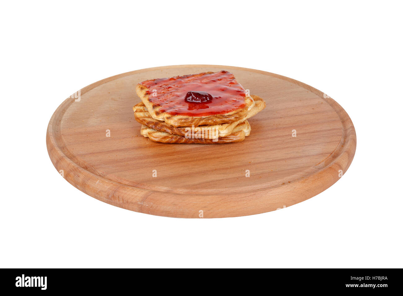 Burnt toasted bread with jam on wooden table, isolated on white ...