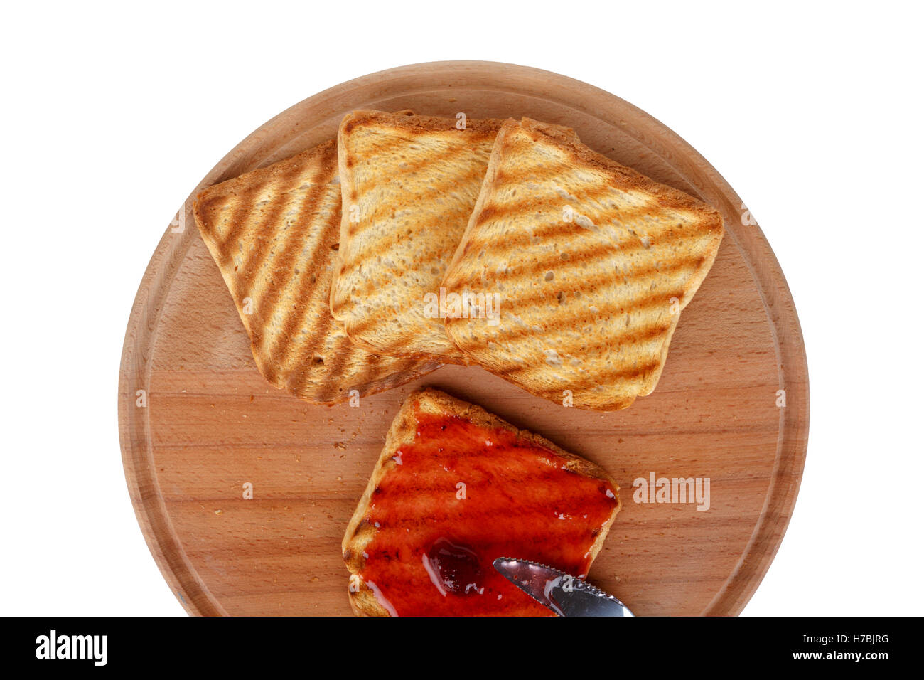 Top view of burnt toasted bread with jam, isolated on white background ...