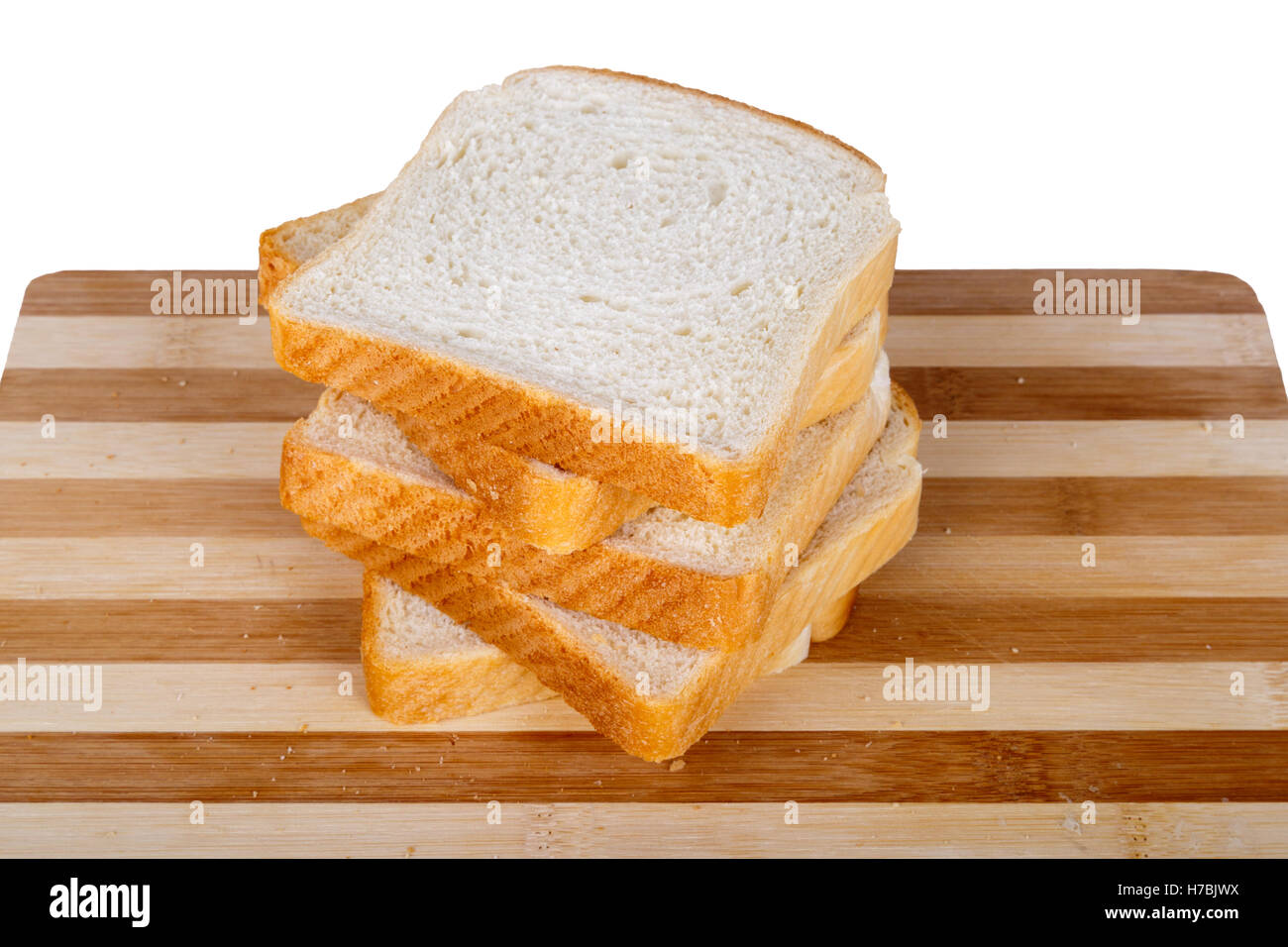 View of slices of toast bread on breadboard, isolated on white ...