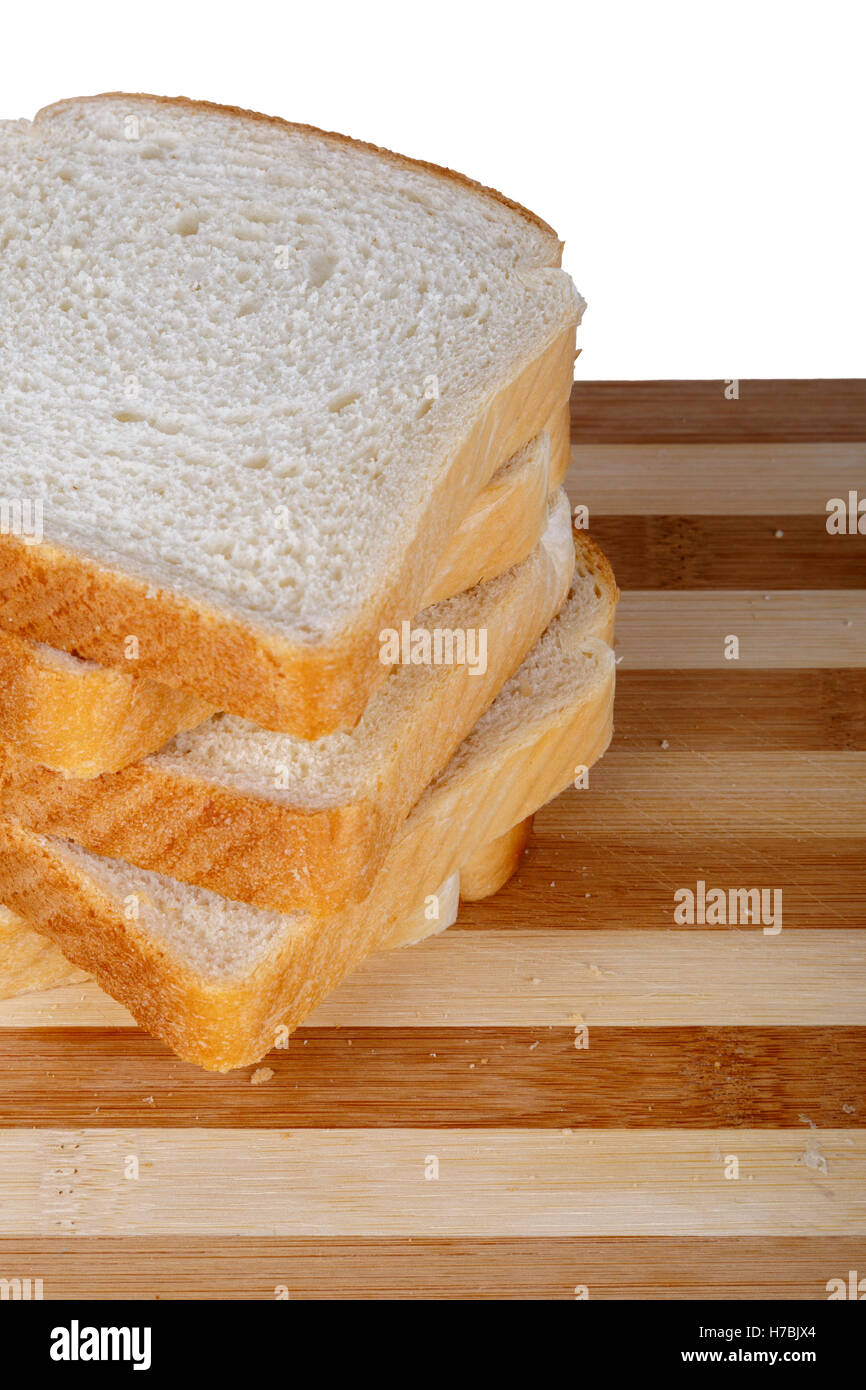 View of slices of toast bread on breadboard, isolated on white ...