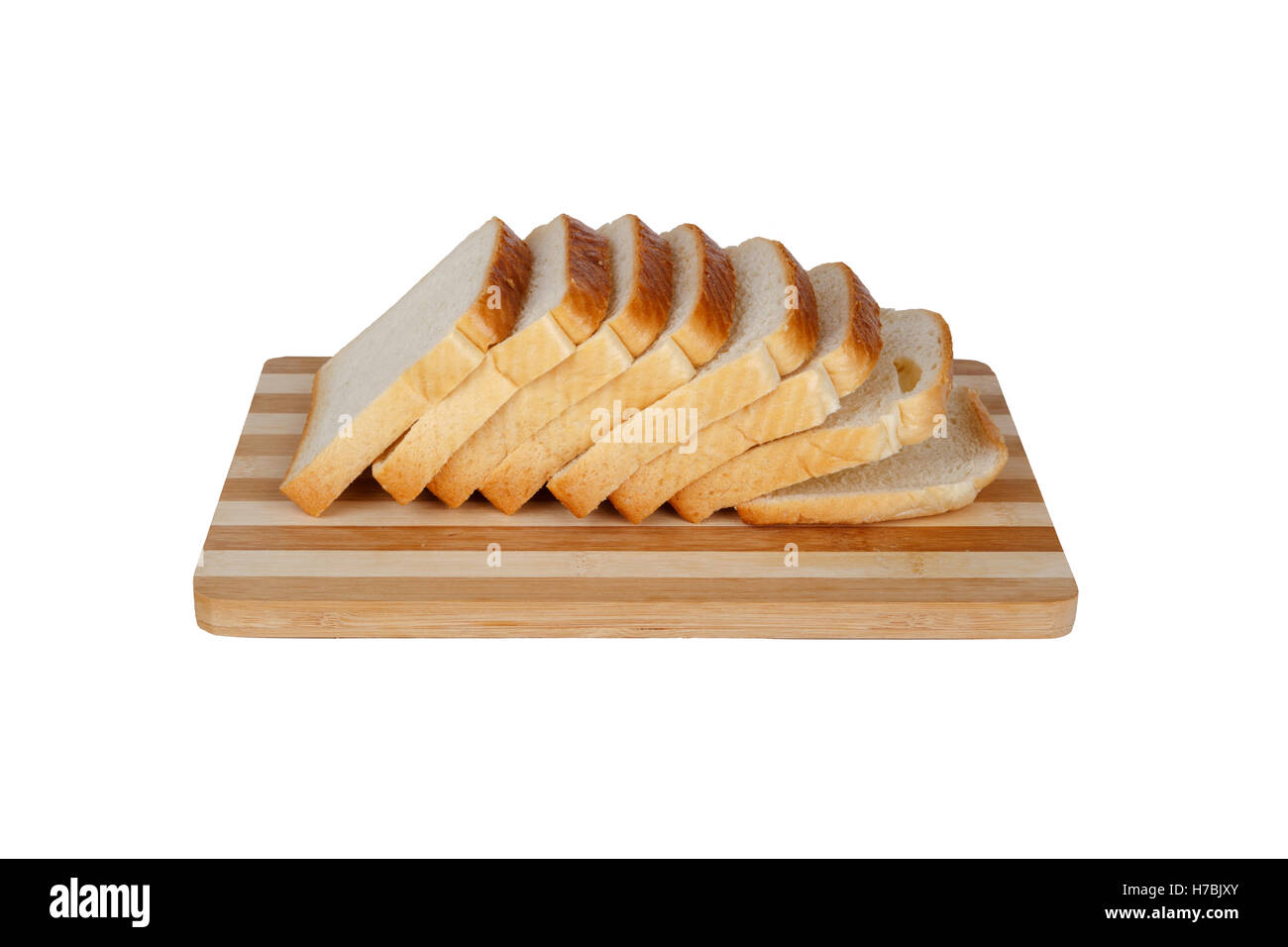 Side view of slices of toast bread on breadboard, isolated on white ...