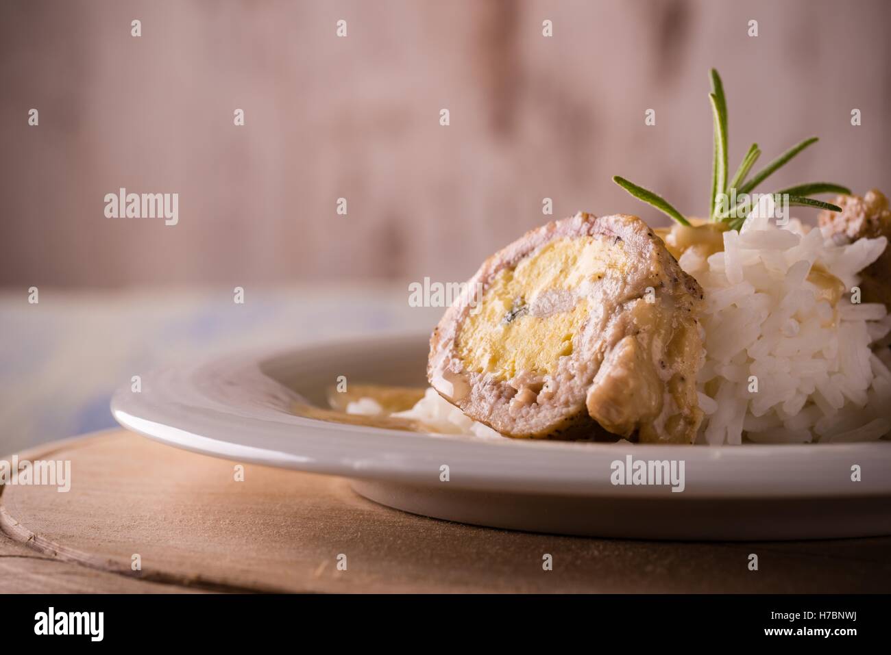 Horizontal photo with portion of meat rolls with rice. Food placed on ...