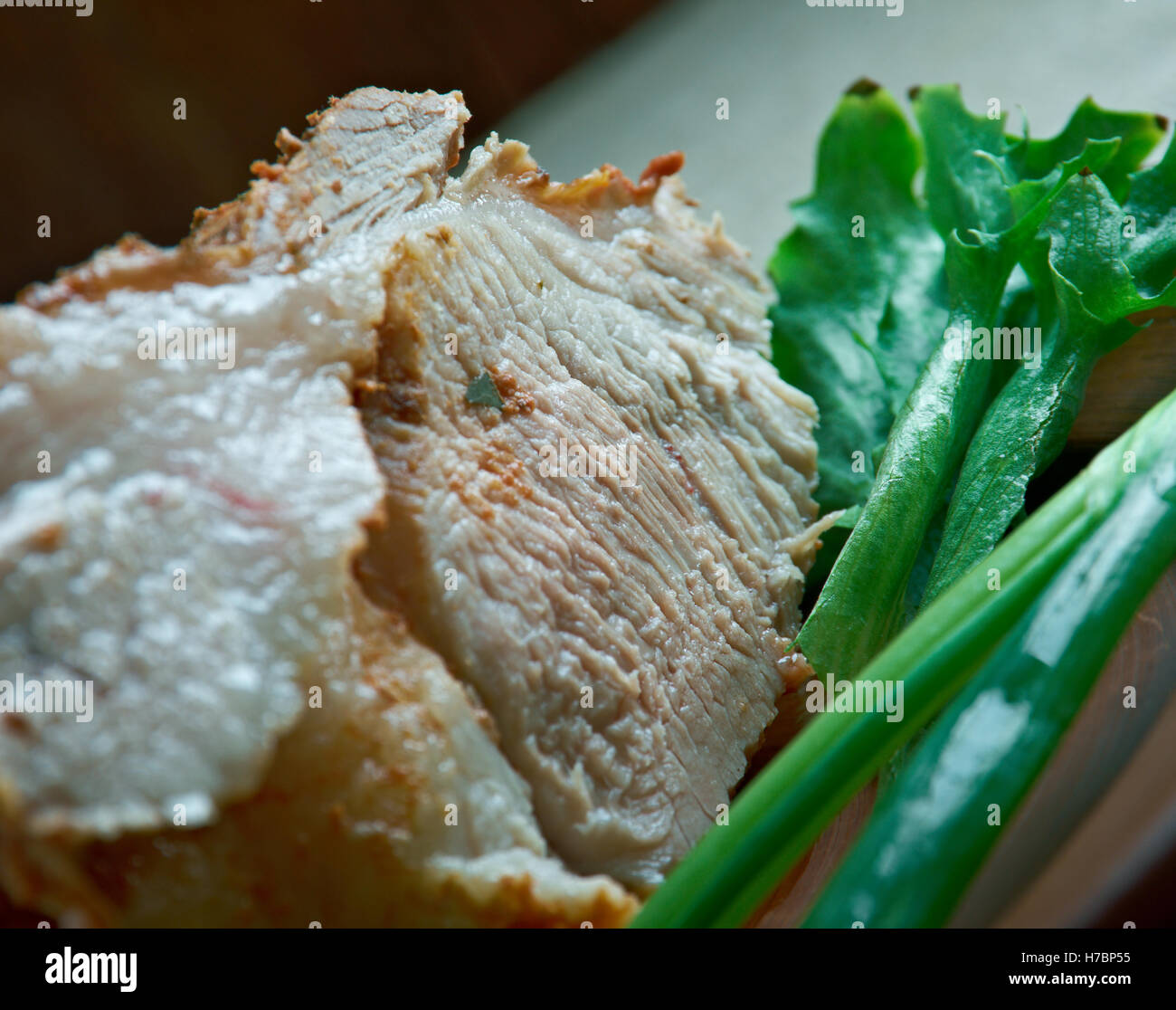 Kumpis - Lithuanian pork cooked ham.the old wooden background ...