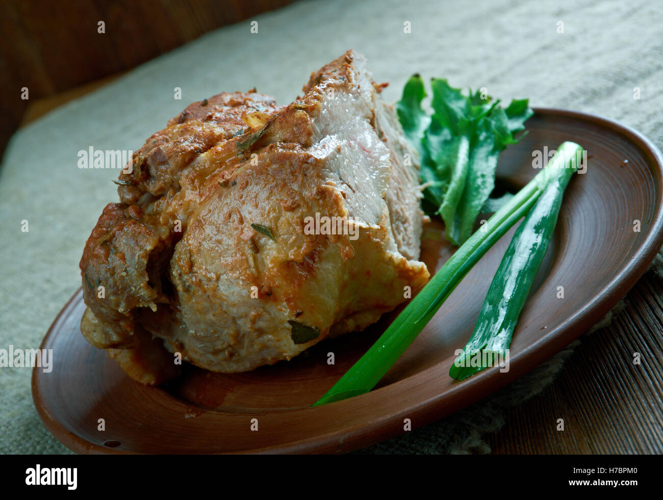 Kumpis - Lithuanian pork cooked ham.the old wooden background ...