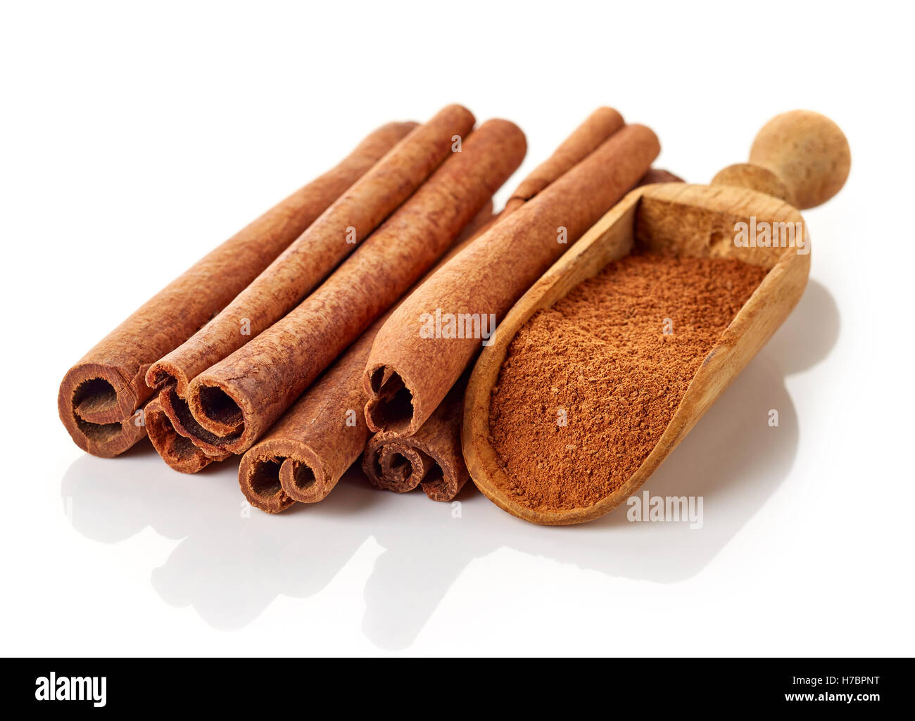 Heap of cinnamon sticks and powder isolated on white background Stock ...