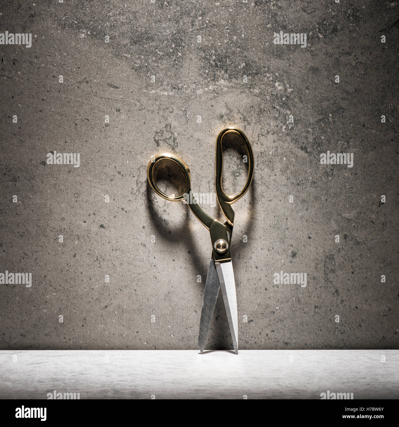 Pair of scissors and stone wall. Still life of sewing and tailoring ...