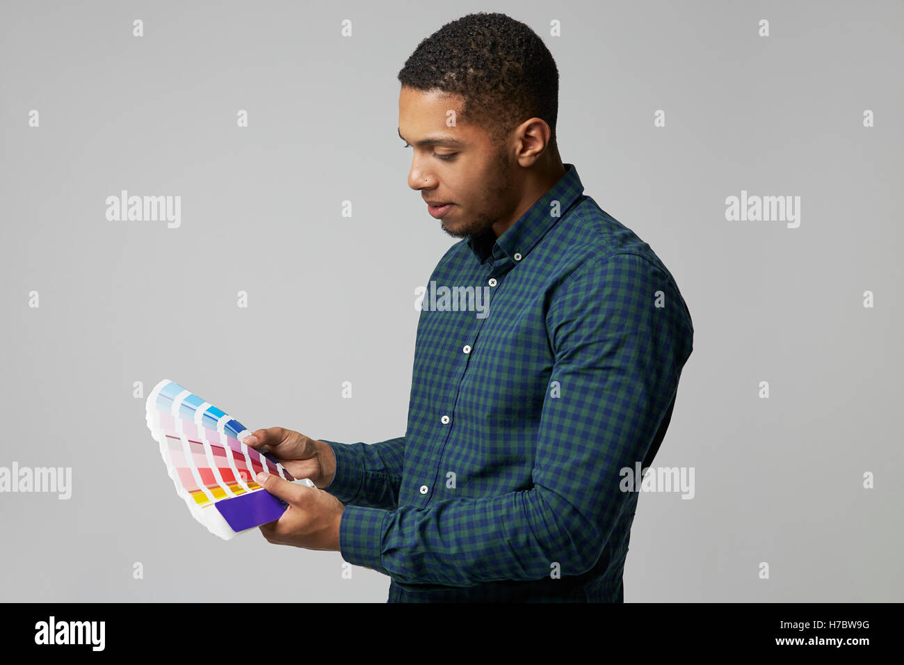 Studio Portrait Of Graphic Designer With Color Swatches Stock Photo - Alamy
