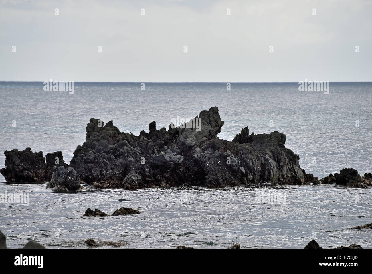 Jagged rocks off Dead Man's Beach near Georgetown on Ascension Island ...