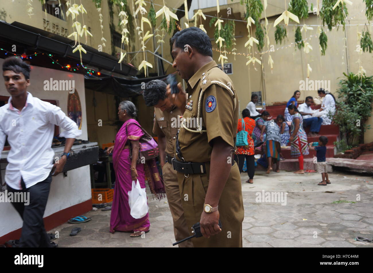 Policemen are standing in the courtyard of a Hindu temple in Kandy, Sri ...