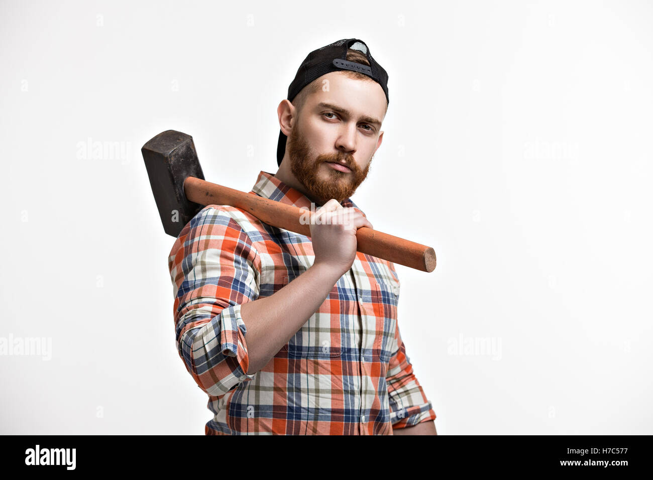 Portrait of bearded man with hammer Stock Photo - Alamy