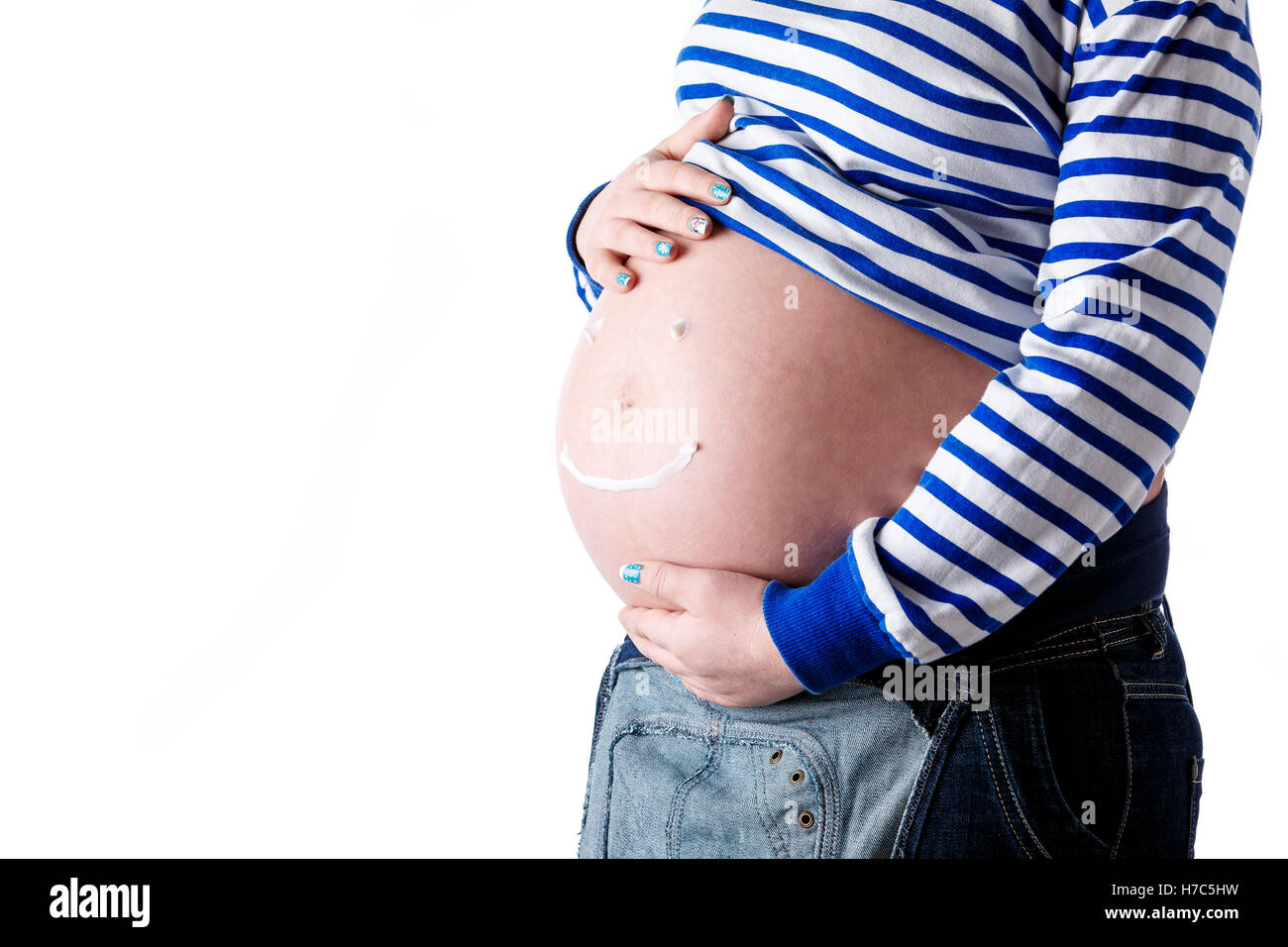 Pregnant woman writing 'smiley' word on her belly. Isolate Stock Photo ...