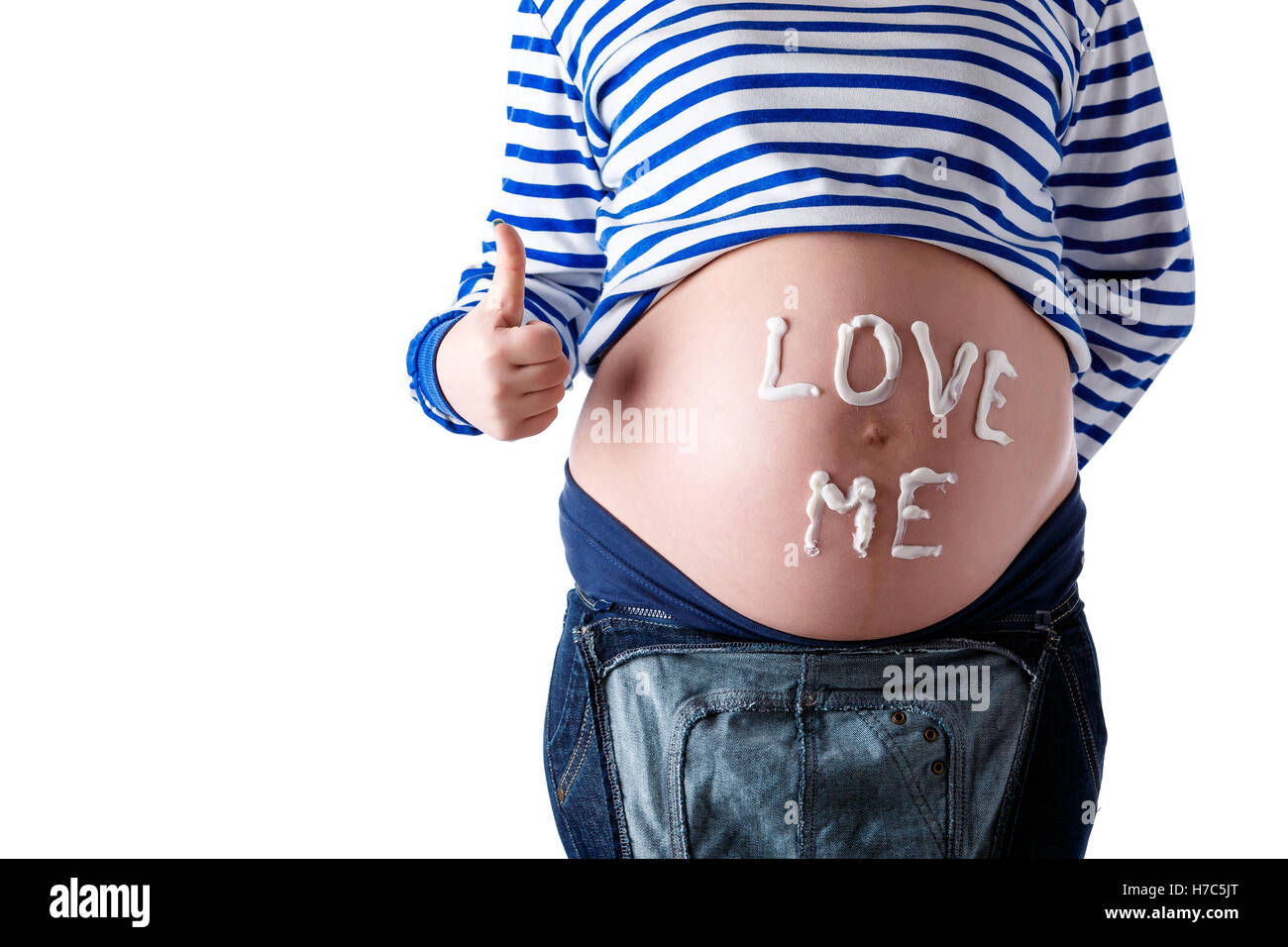 Pregnant woman writing 'love me' word on her belly. Isolate Stock Photo ...