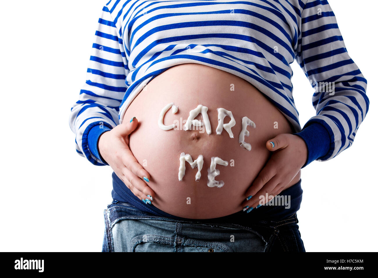 Pregnant woman writing 'care me' word on her belly. Isolate Stock Photo ...