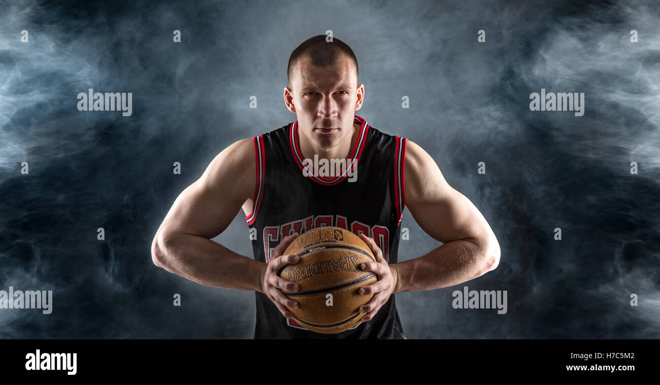 Professional basketball player with ball Stock Photo - Alamy