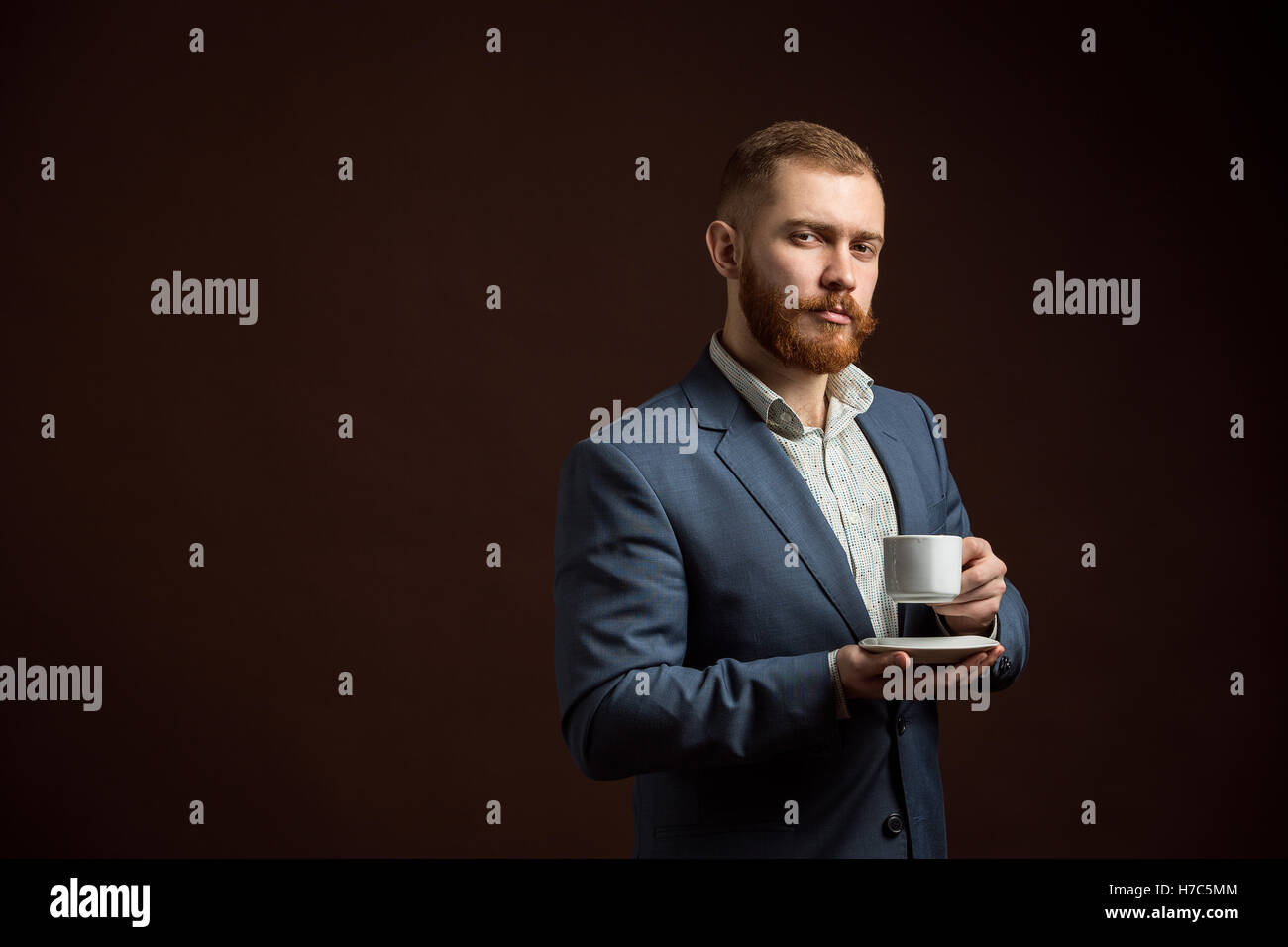 Elegant bearded man with cup of coffee Stock Photo - Alamy