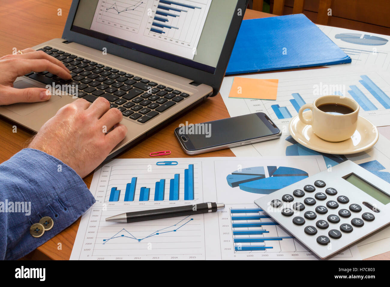 office desk with charts , histograms and financial documents Stock ...
