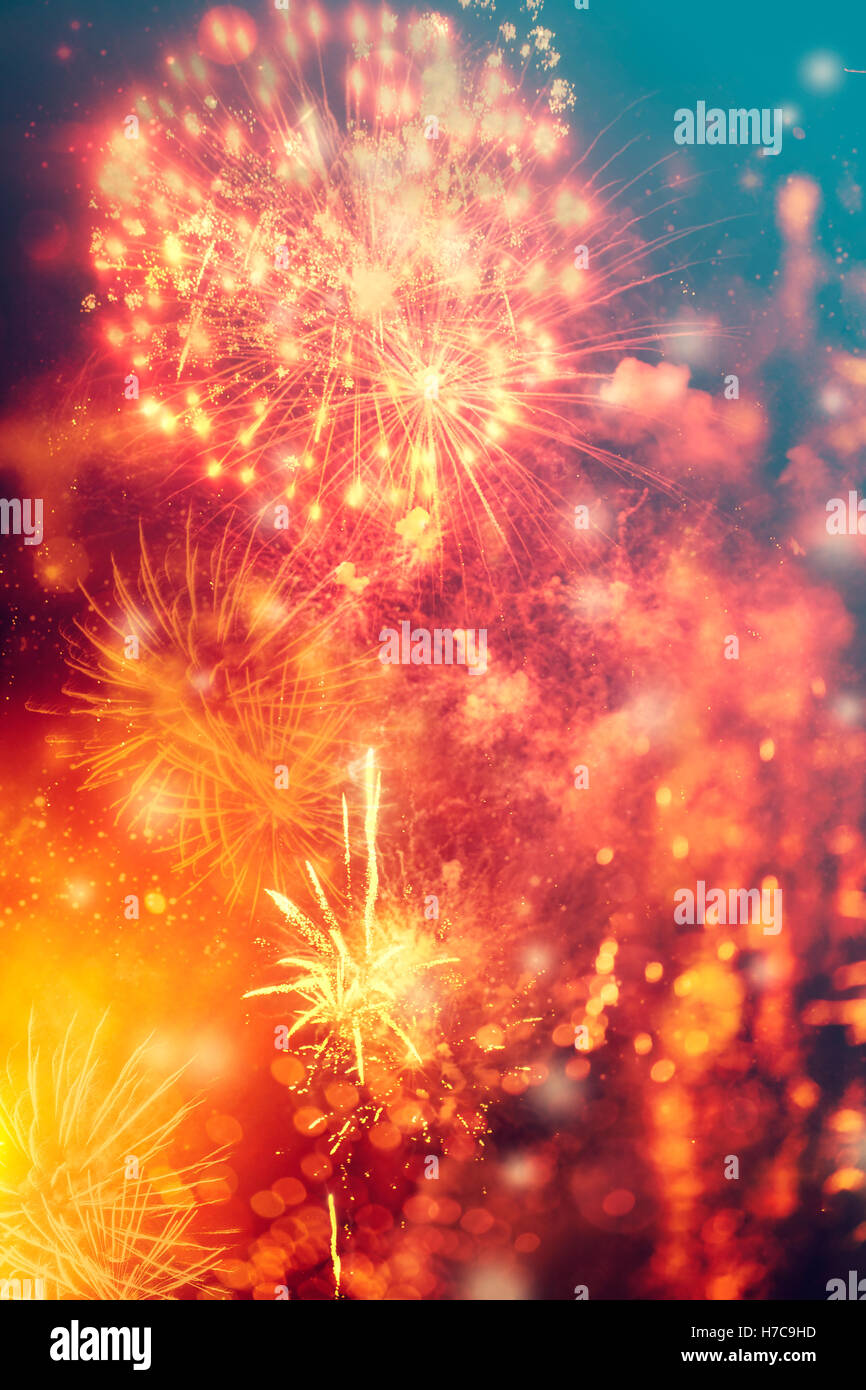 Abstract colorful holiday background of sky with fireworks and stars ...