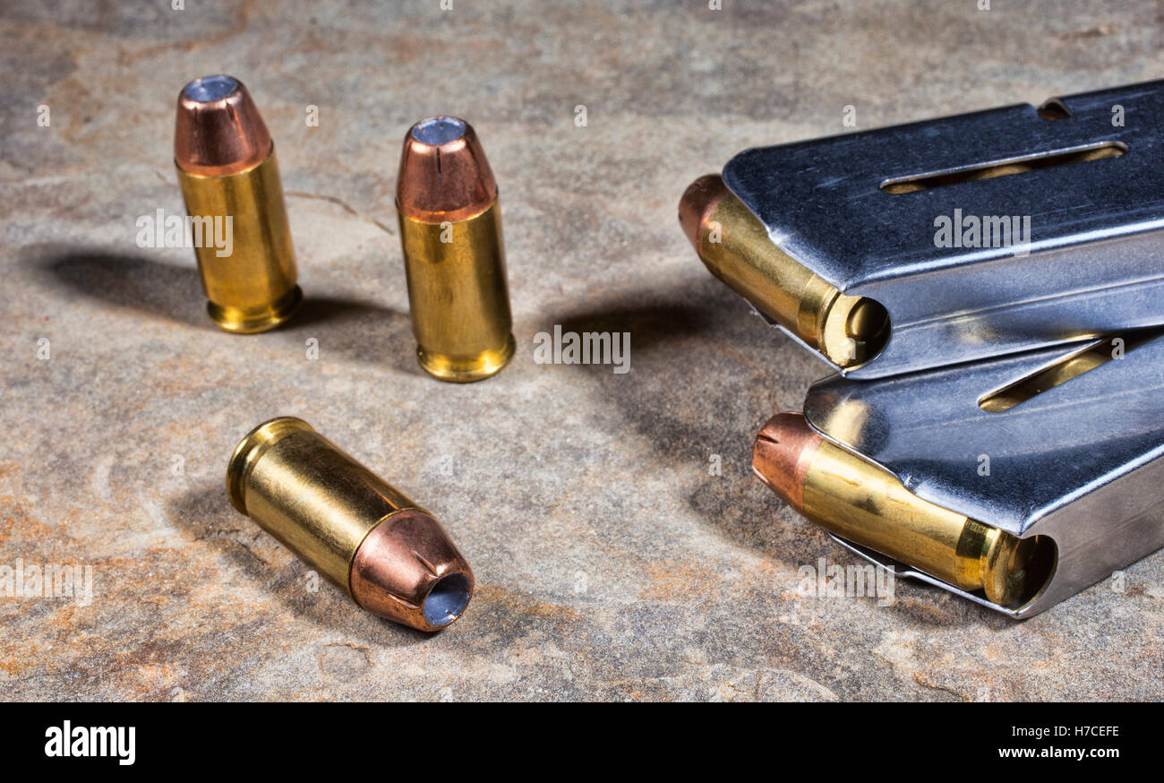 Cartridges with hollow point bullets for a handgun with magazines Stock ...