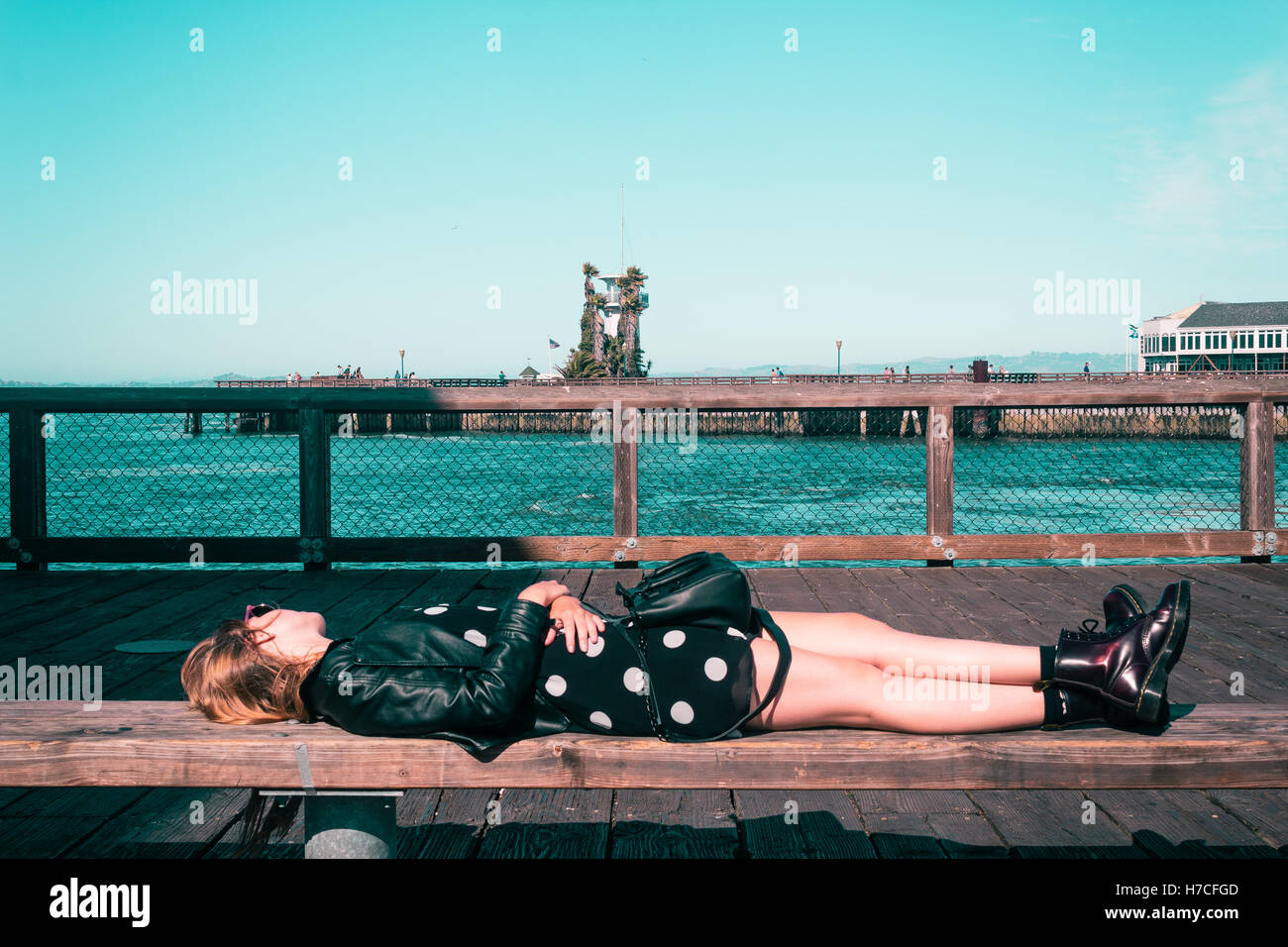 Photo of Girl Lying Down on a Bench at San Francisco, California Stock ...