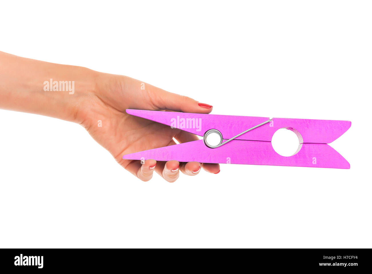 Large clothes pin in his hand Stock Photo - Alamy