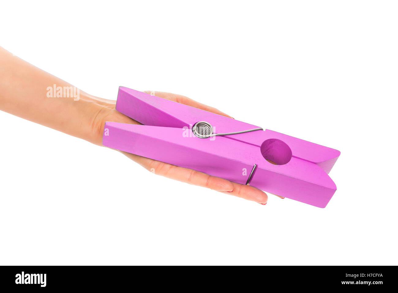 Large clothes pin in his hand Stock Photo - Alamy