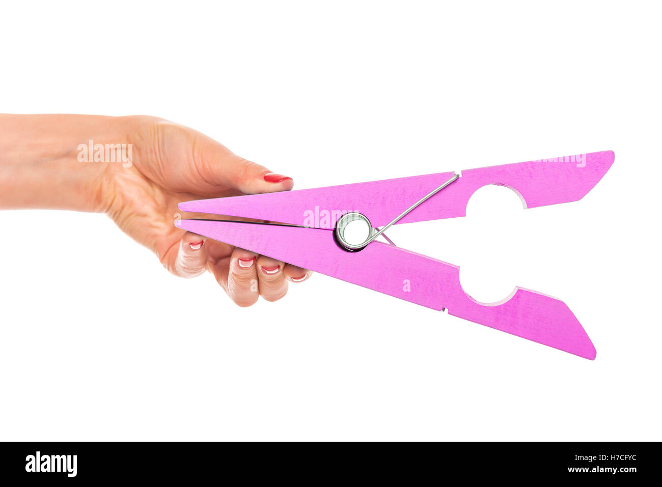 Large clothes pin in his hand Stock Photo - Alamy