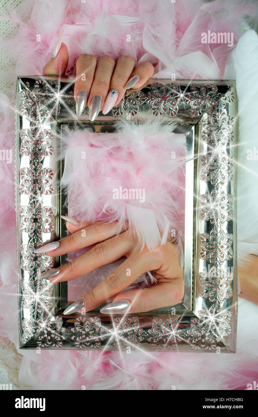 beautiful fingernails decorated with pink and pearl colors with ...