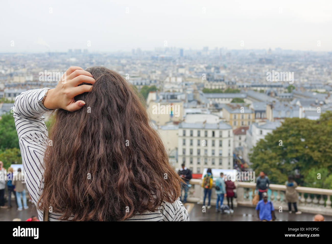 Girl enjoying the view over Paris from Montmartre Stock Photo - Alamy