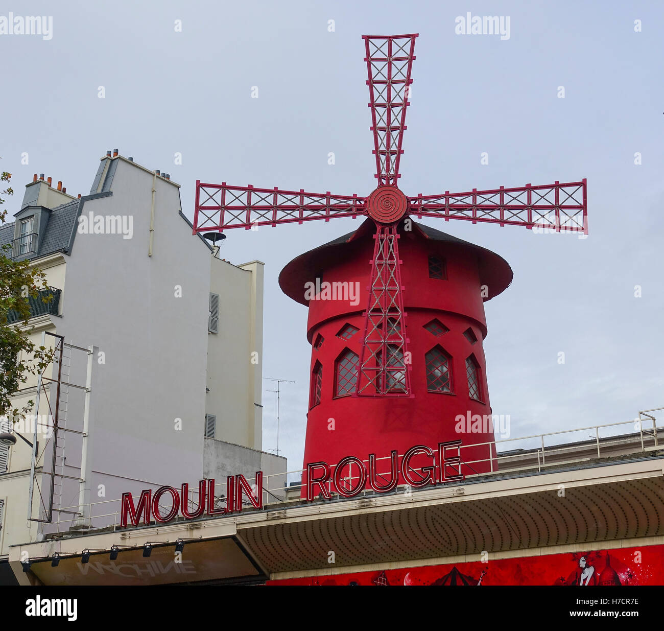 Famous red mill at Moulin Rouge cabaret in Paris - a tourist attraction ...