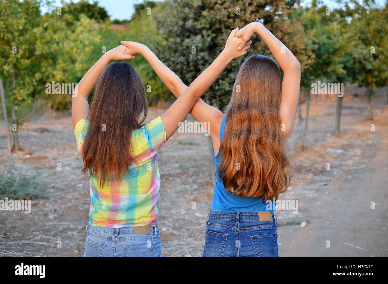 Best Friends Forever - two 12 year old teenage girls holding hands in ... Best Friends Forever - two 12 year old teenage girls holding hands in ...