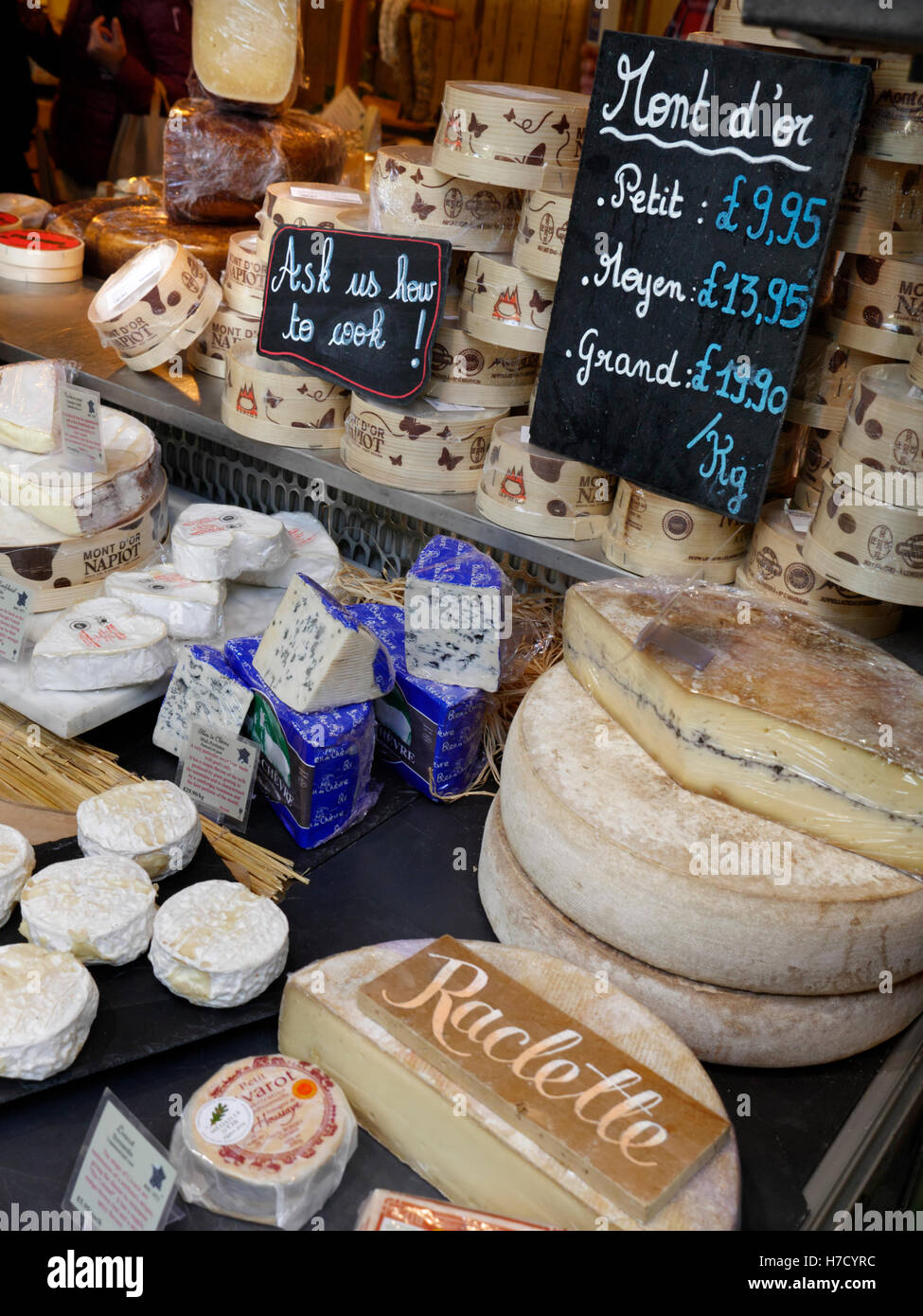 French Cheese market stall varieties including Mont d’Or and Raclette ...