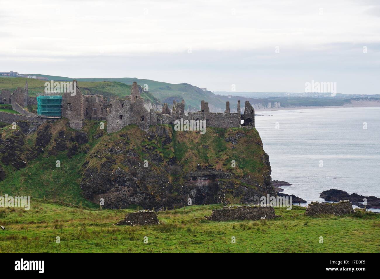 Ruins of the medieval Dunluce Castle on a cliff in Northern Ireland ...