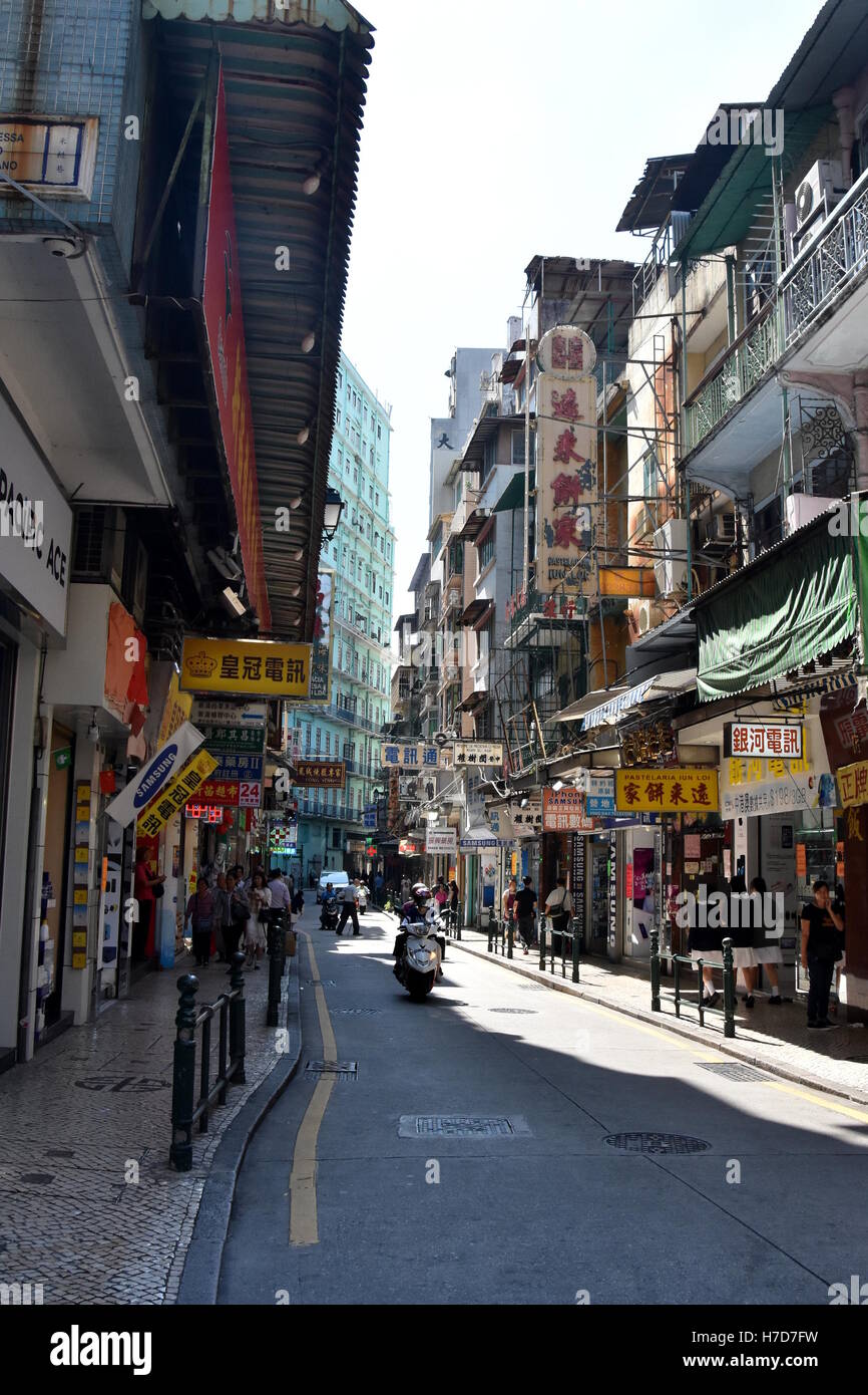 Macau, China - Oct 28, 2016. Narrow streets of Macau downtown. Macau is ...