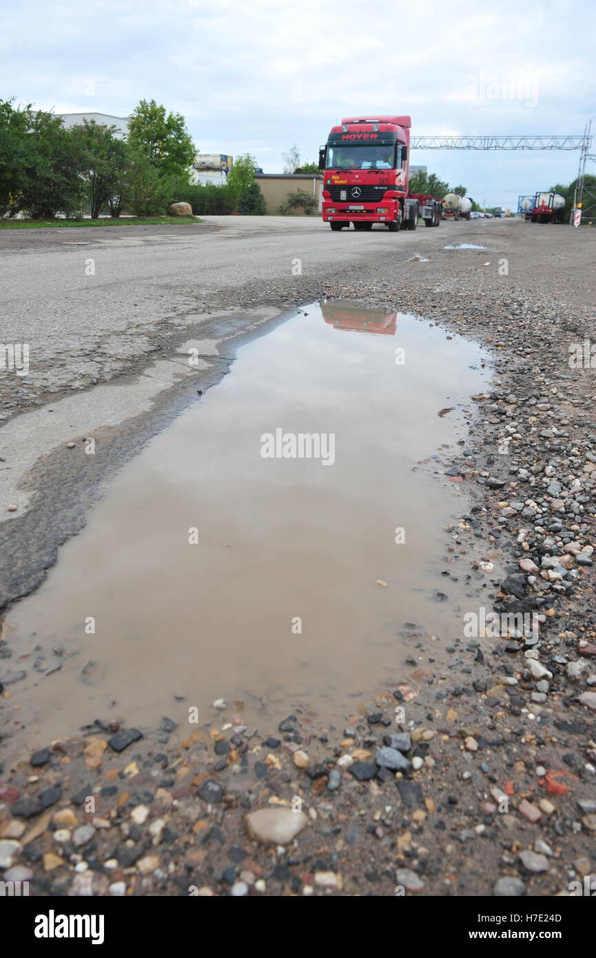 Frankfurt, Germany - September 9, 2010 - Potholes in damaged street ...